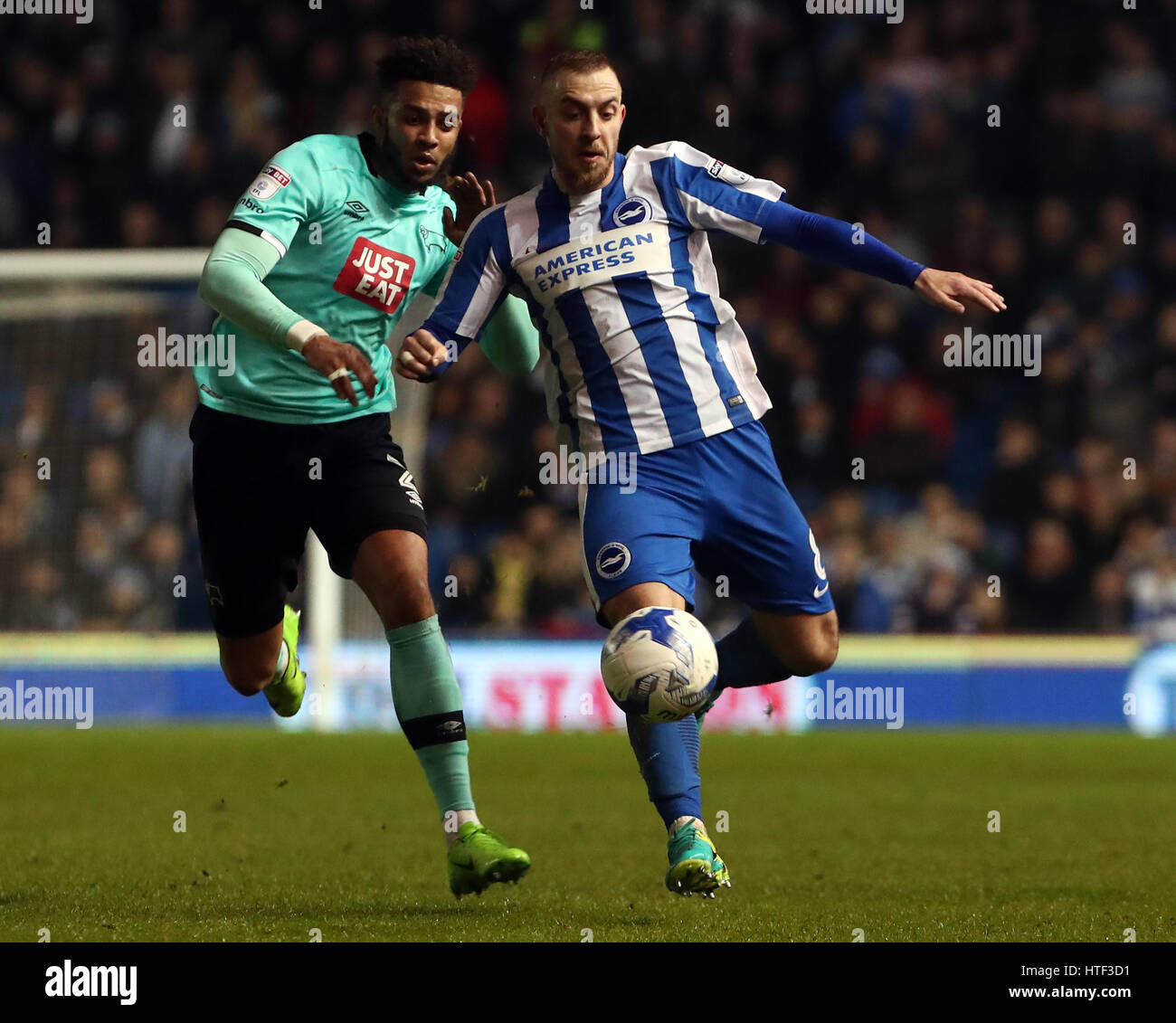 Derby County's Cyrus Christie (left) challenges Brighton & Hove Albion ...