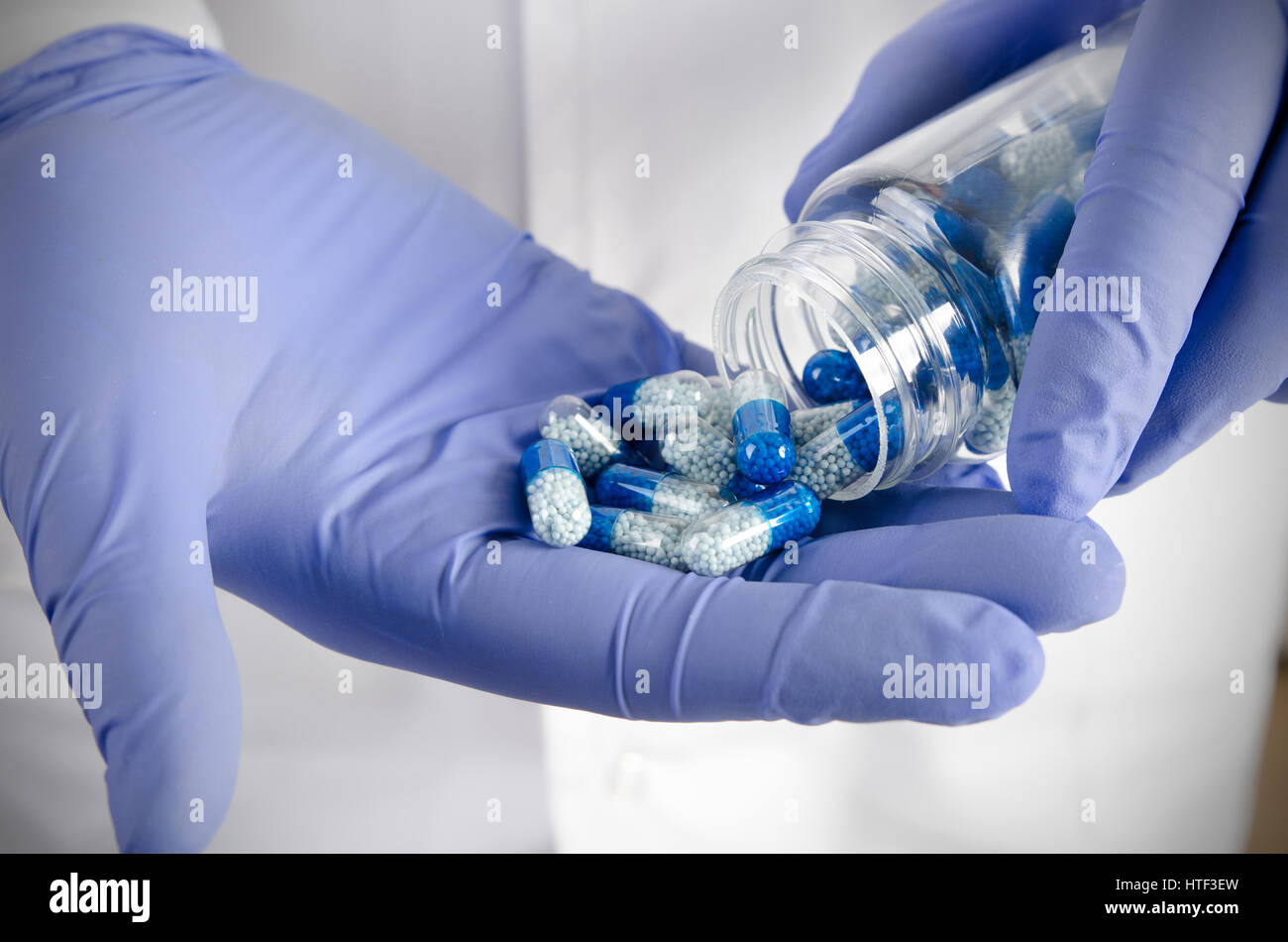 Person pouring out pills on hand. pill doctor hand pour capsule bottle ...