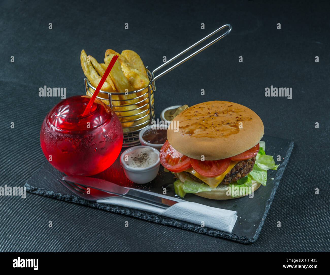 right side view on a flame grilled double stack cheeseburger, lettuce ...