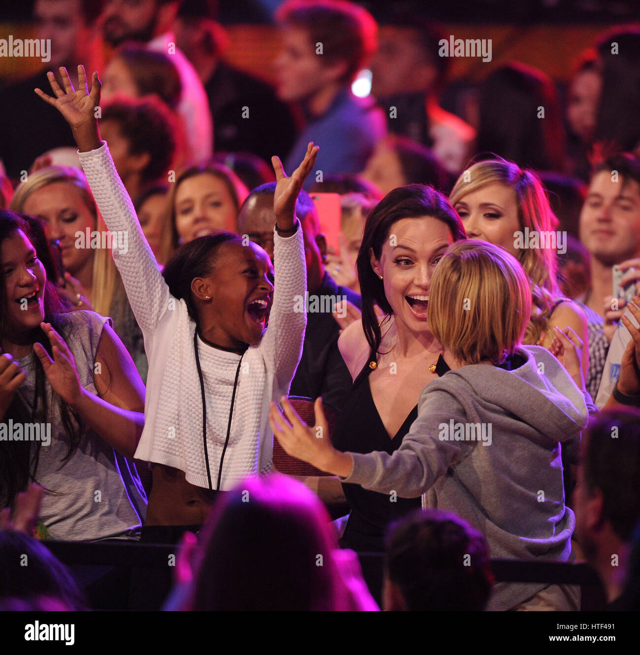 INGLEWOOD, CA - MARCH 28: Angelina Jolie hugs Zahara Marley Jolie-Pitt ...