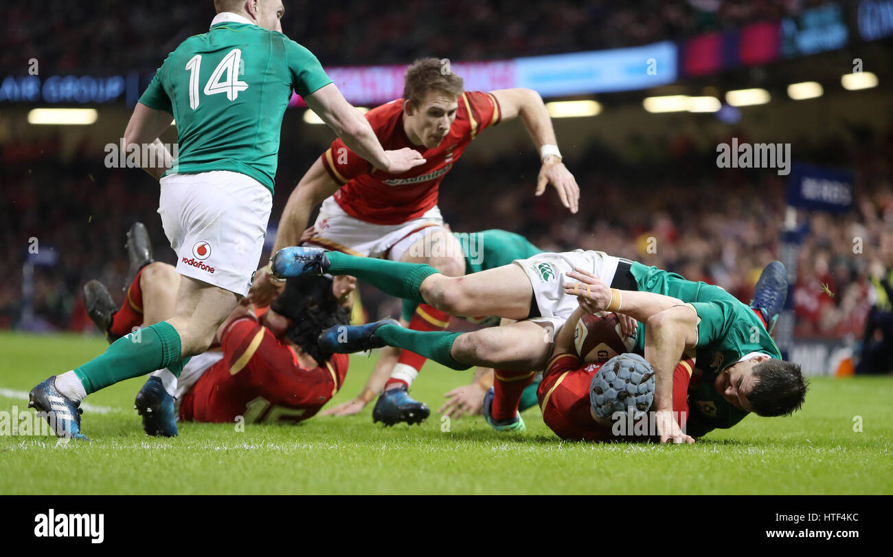 Wales Jonathan Davies Is Tackled By Irelands Johnny Sexton During The