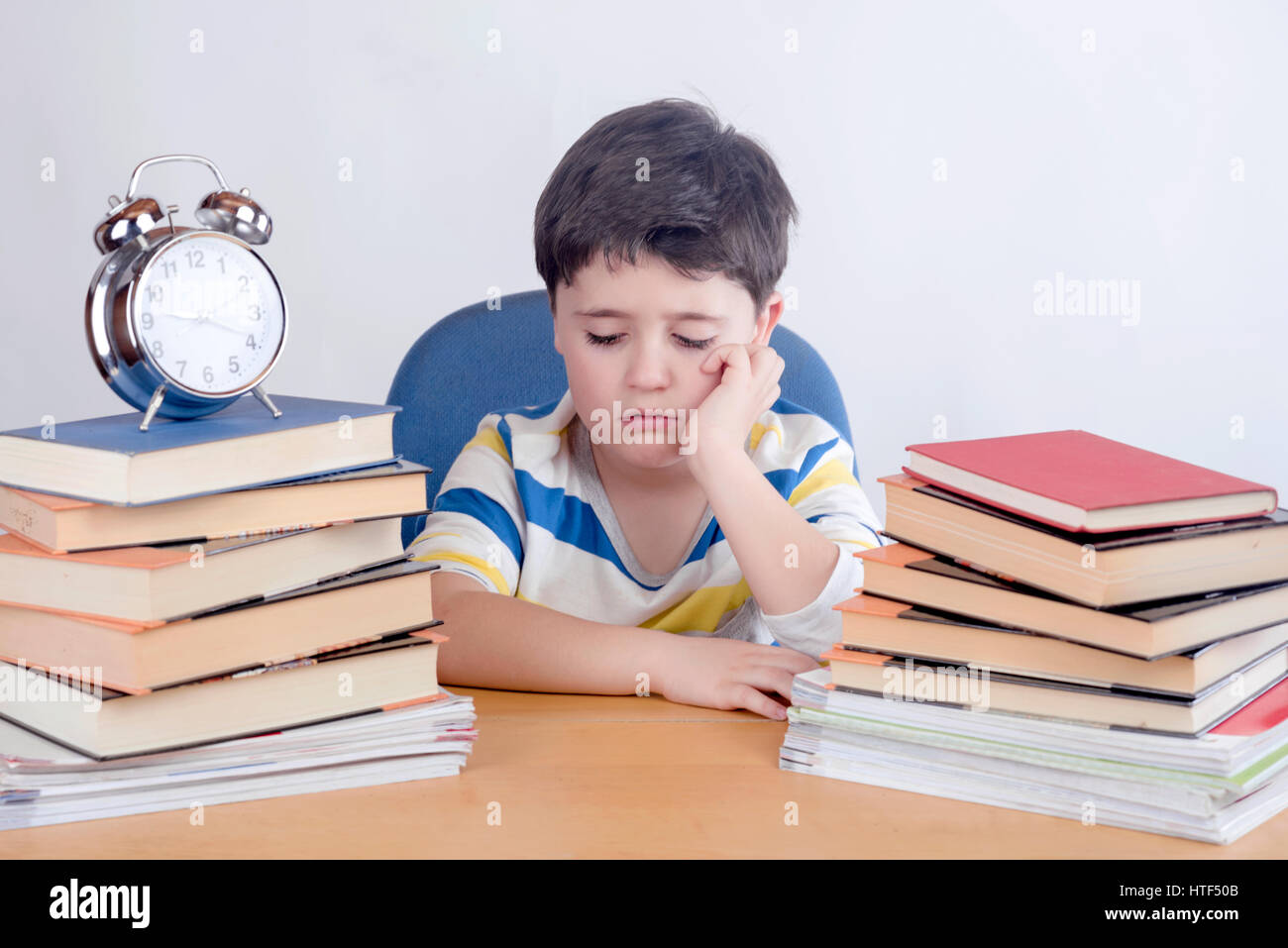 Boring schoolboy studying Stock Photo - Alamy