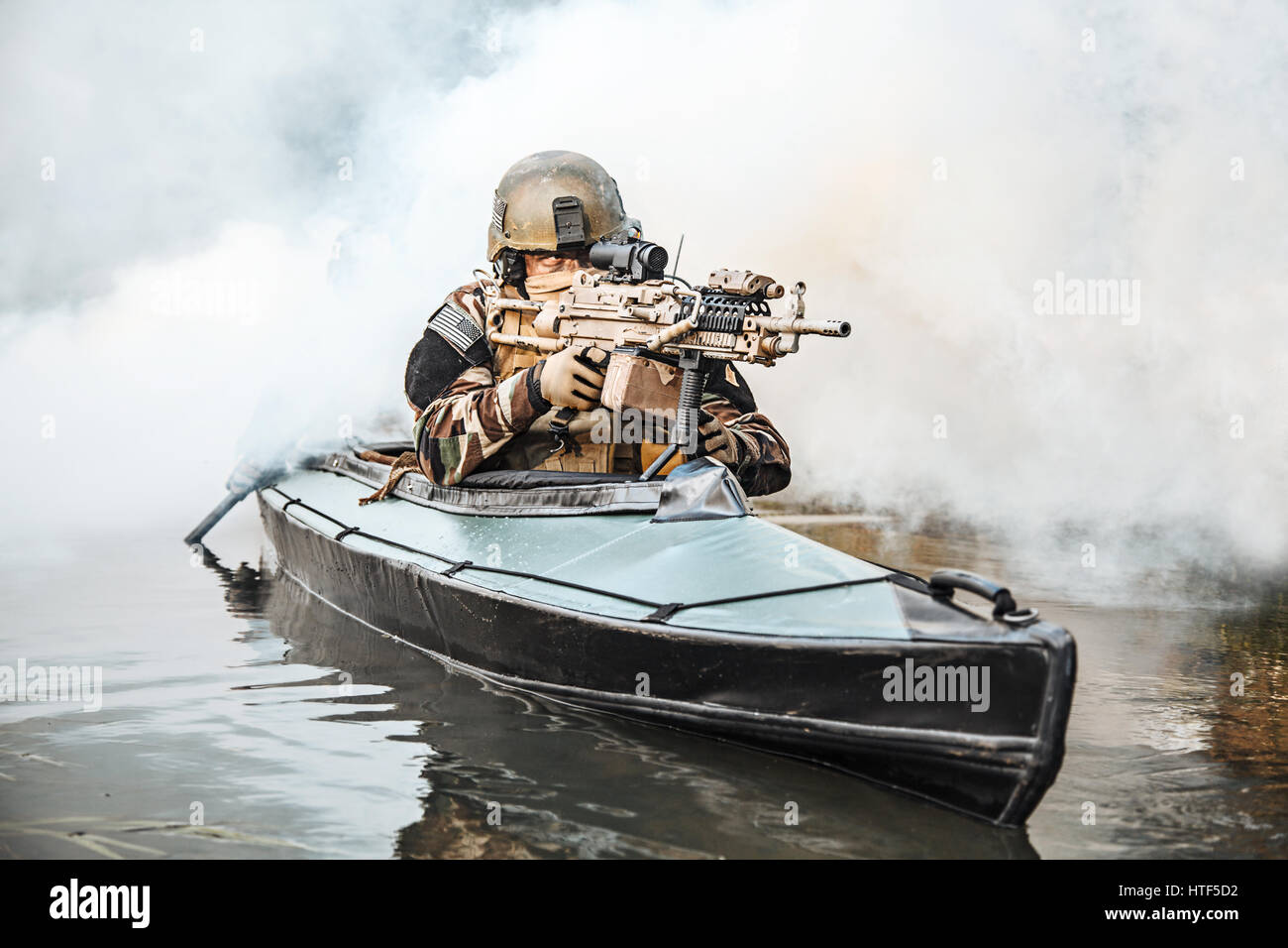 Special forces marine operators in camouflage uniforms paddling army ...