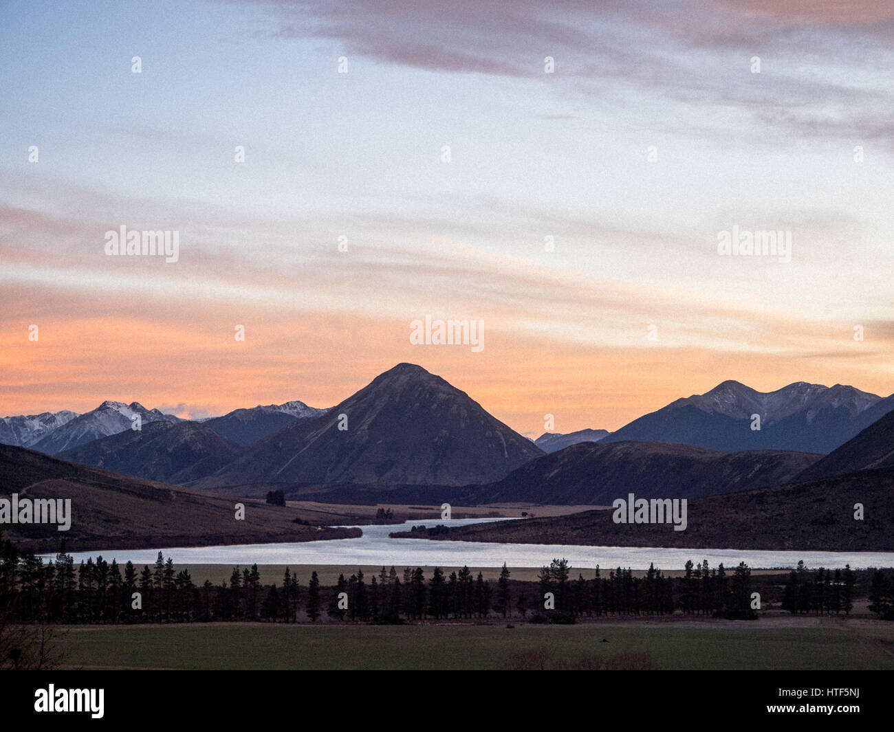Mountain lake at dawn. Lake Pearson, Flock Hill, Canterbury, South ...