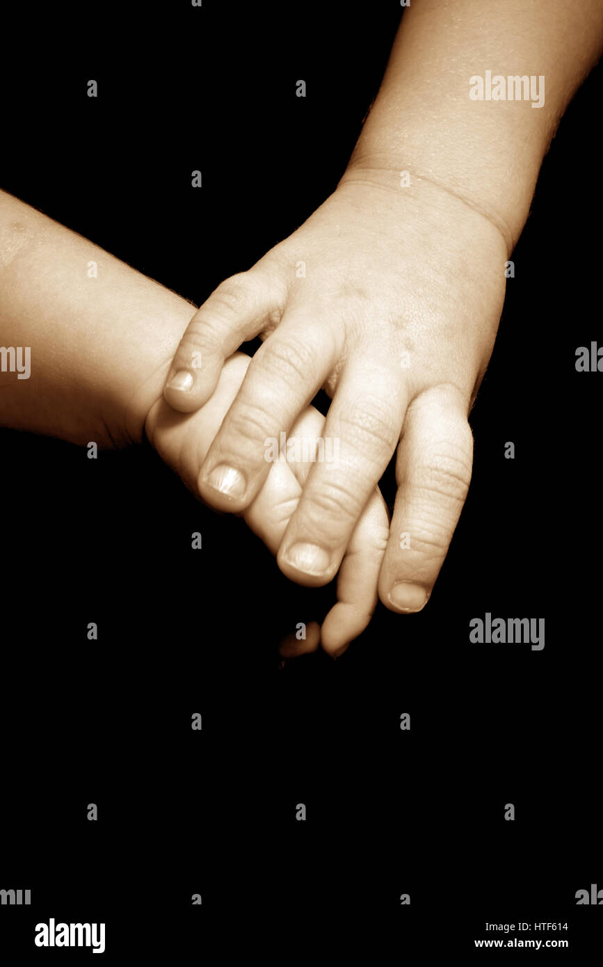 sister holding brothers hand Stock Photo - Alamy