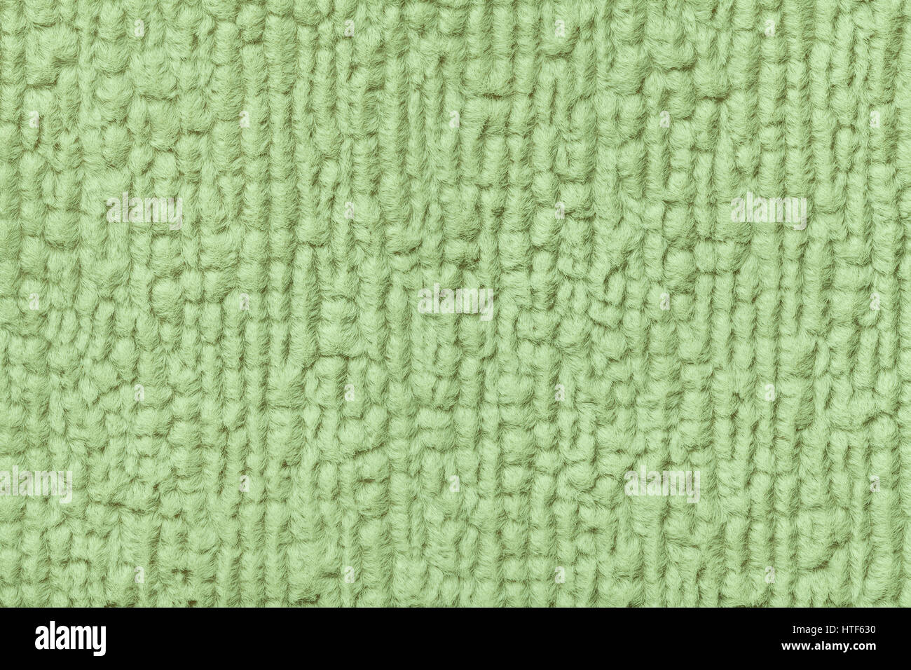 Light green fluffy background of soft, fleecy cloth. Texture of textile ...