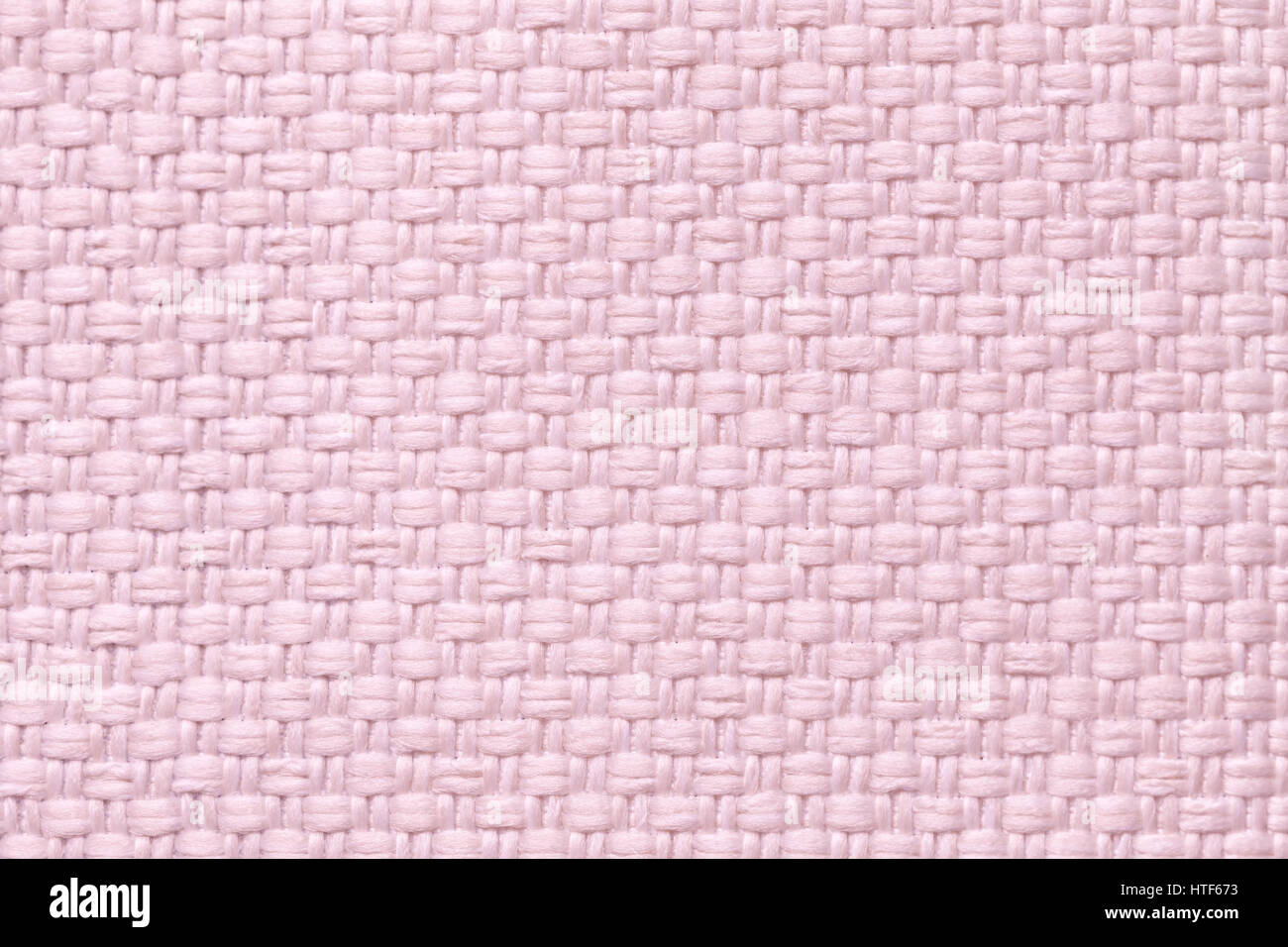 Light pink background with checkered pattern, closeup. Structure of the ...