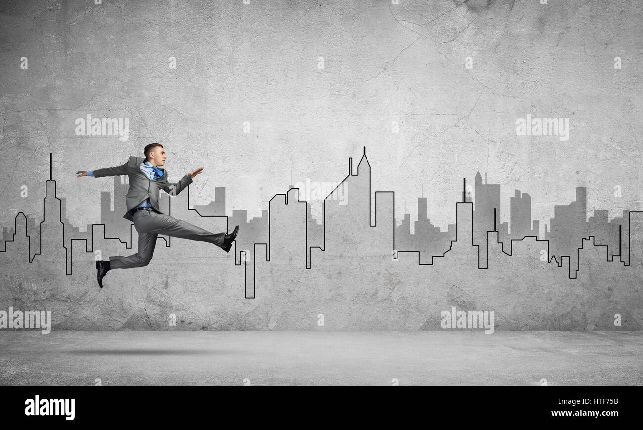 Young businessman in room running in a hurry Stock Photo - Alamy