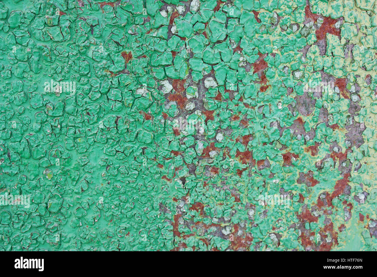 Green rusty background, rough, rough texture in the cracks. Corrosion ...