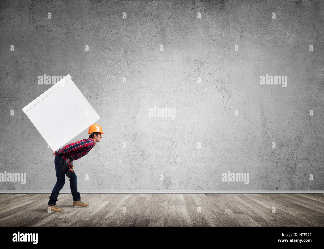 Man carrying on his back large box Stock Photo - Alamy
