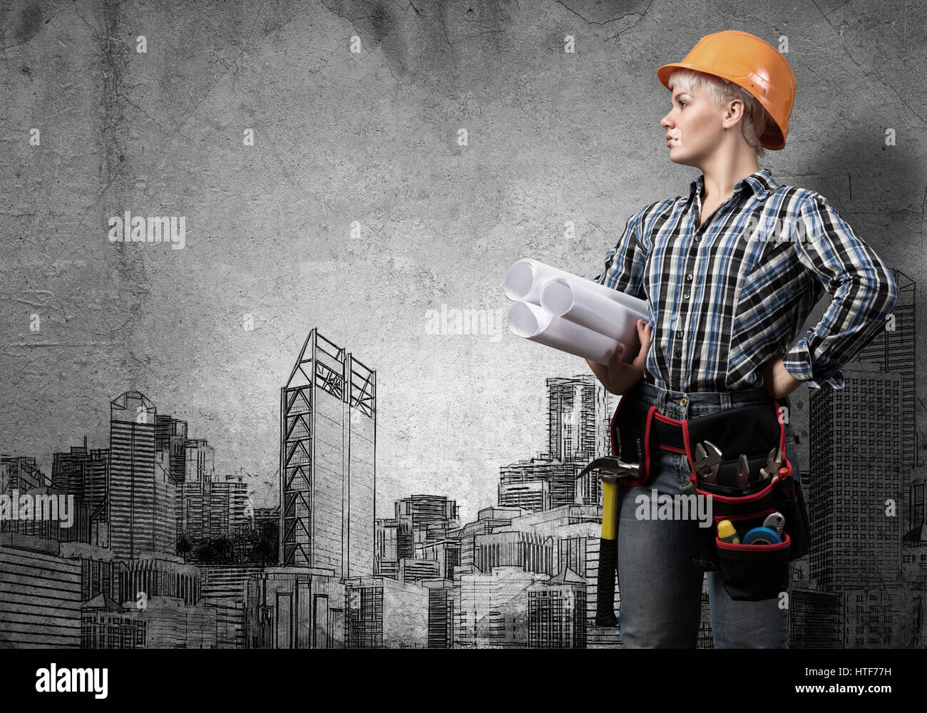 Engineer woman with blueprints and sketches of construction project on ...