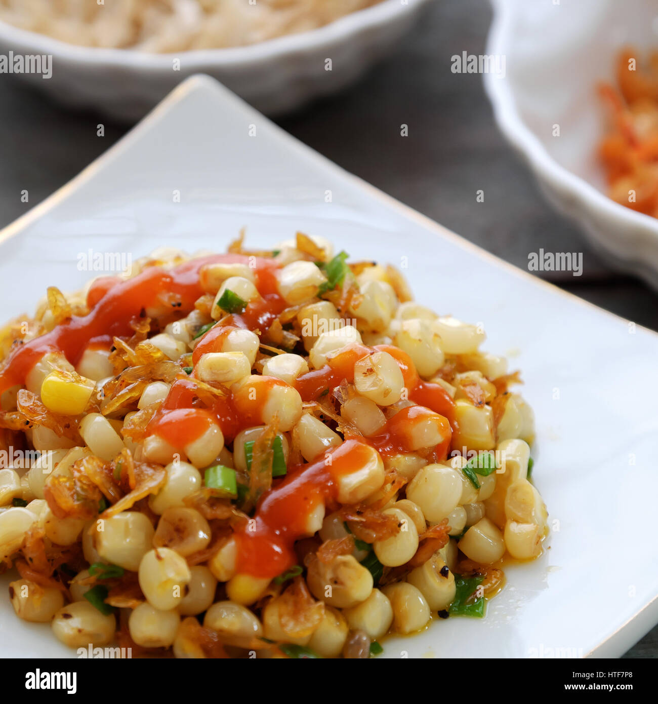 Vietnamese street food, corn fried dried shrimp, is popular snack food ...