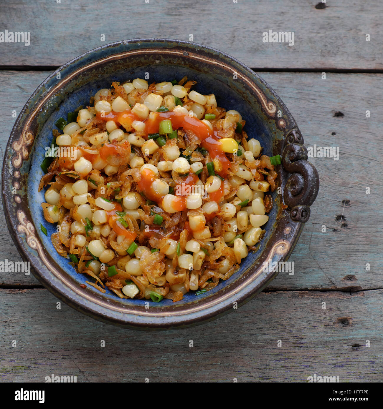 Vietnamese street food, corn fried dried shrimp, is popular snack food ...