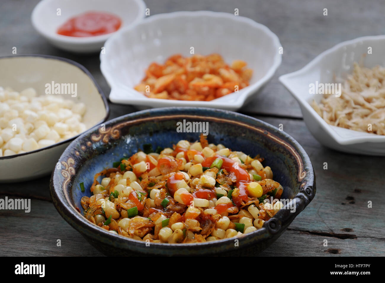 Vietnamese street food, corn fried dried shrimp, is popular snack food ...