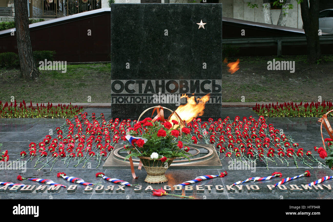 Pyatigorsk, Russia - May 9, 2015: Eternal fire and flowers in memory of ...