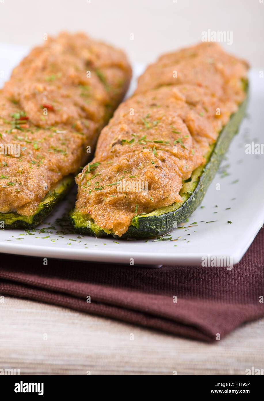 Stuffed zucchini halves Stock Photo - Alamy
