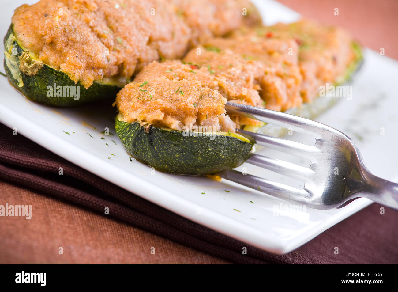 Stuffed zucchini halves Stock Photo - Alamy