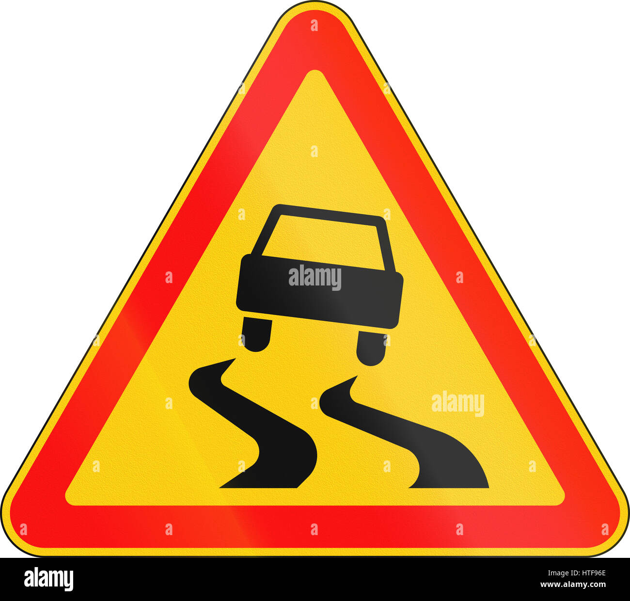 Warning road sign used in Belarus - Slippery road Stock Photo - Alamy
