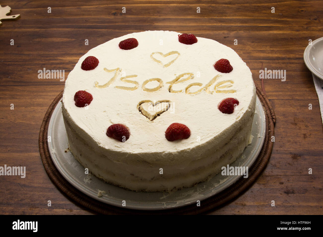 A home made cake is served with decorative ornamentic elements. Eine ...