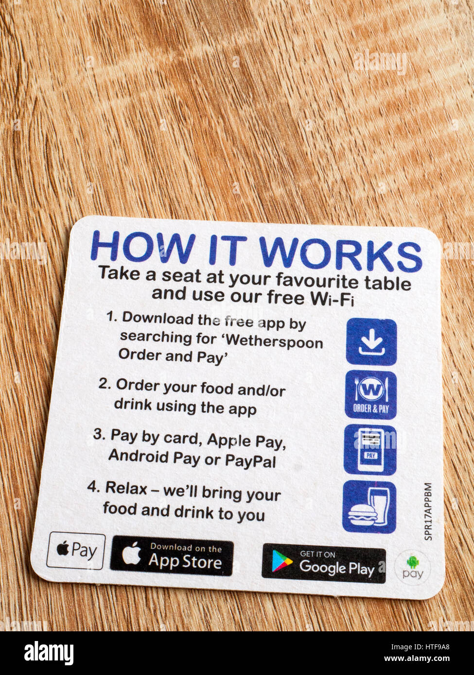 Order & Pay app explained on Wetherspoon beer mat Stock Photo - Alamy
