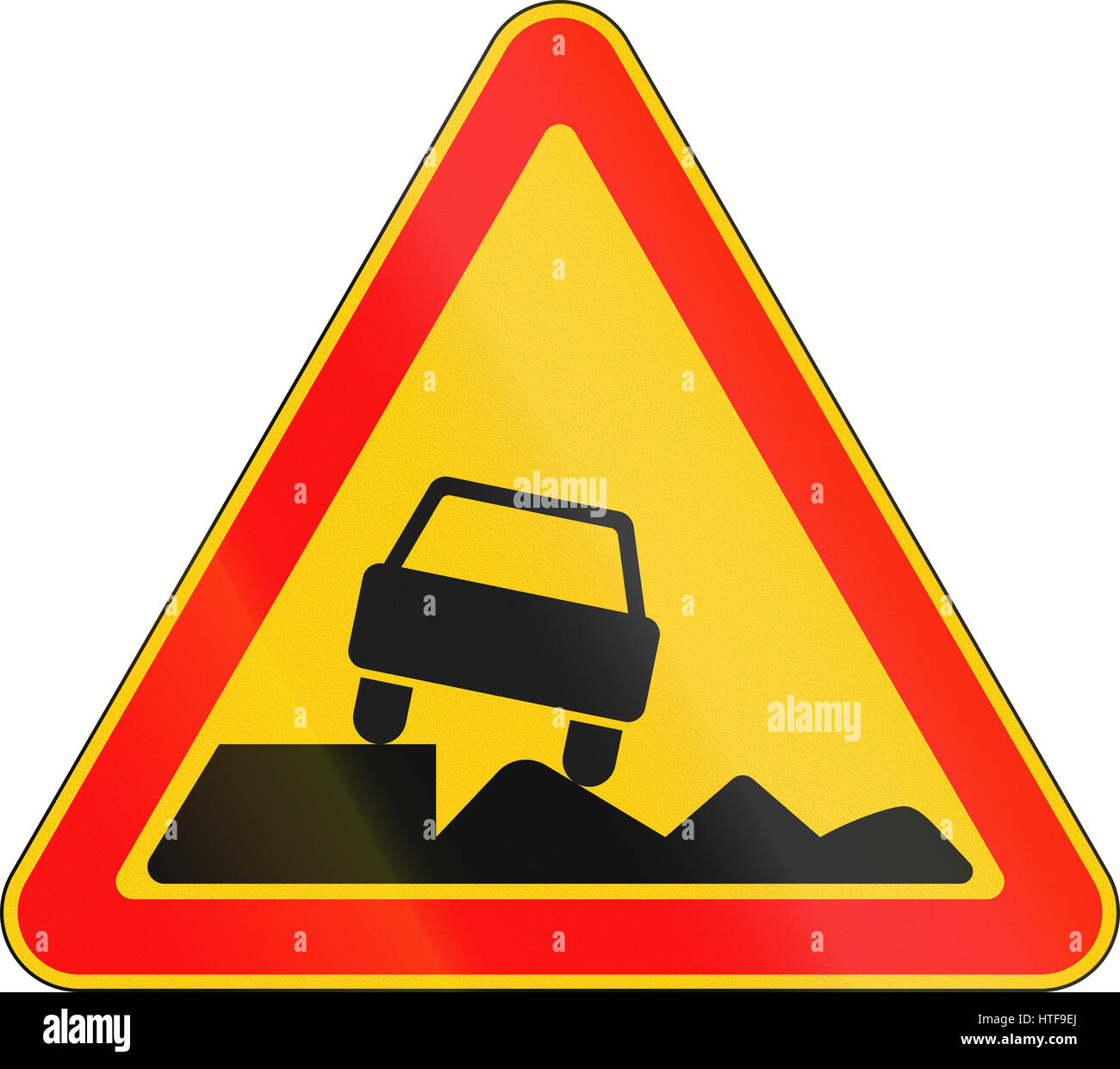 Warning road sign used in Belarus - Soft shoulder Stock Photo - Alamy