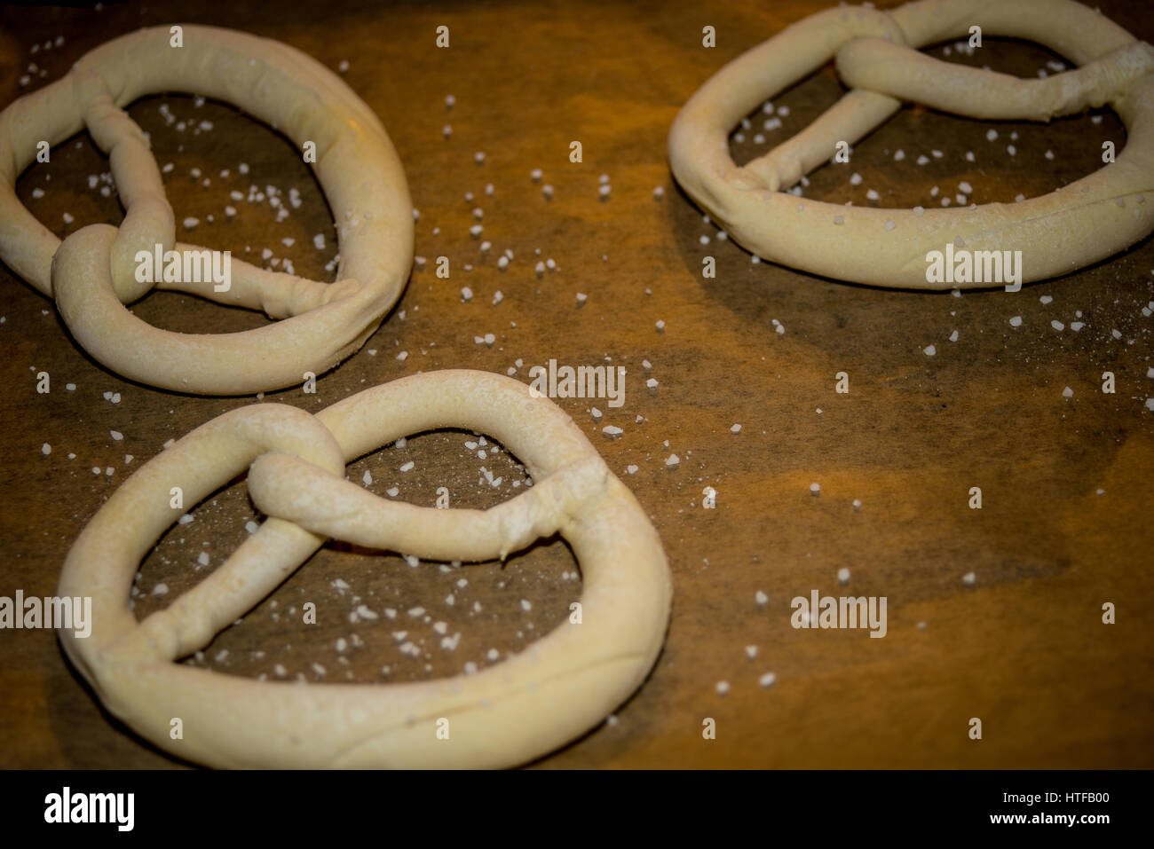 Three brezen ready for baking Stock Photo - Alamy