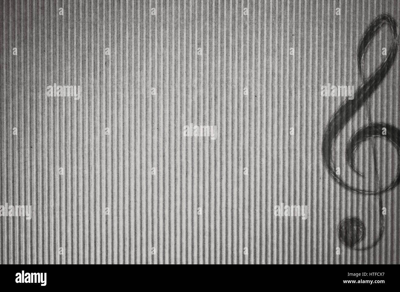 treble clef textured wavy cardboard surface background - copy space ...