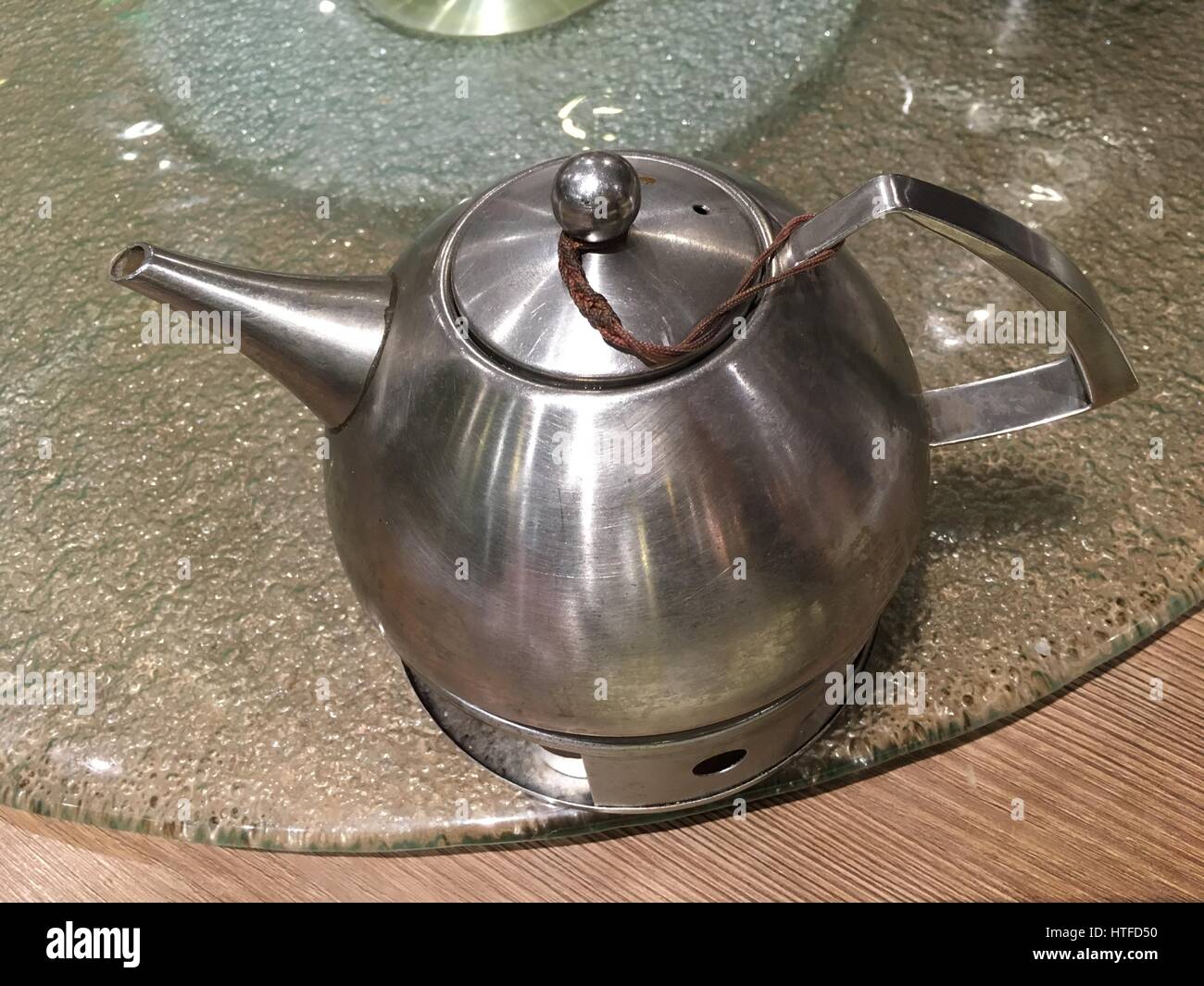 Tea pot bowler in metal Stock Photo - Alamy