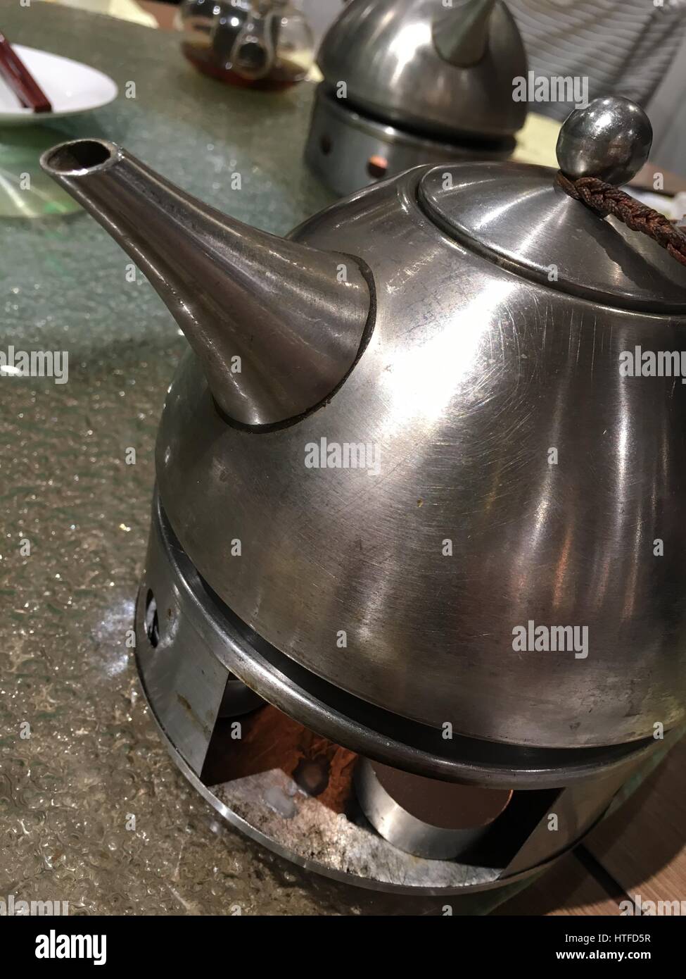 Tea pot bowler in metal Stock Photo - Alamy