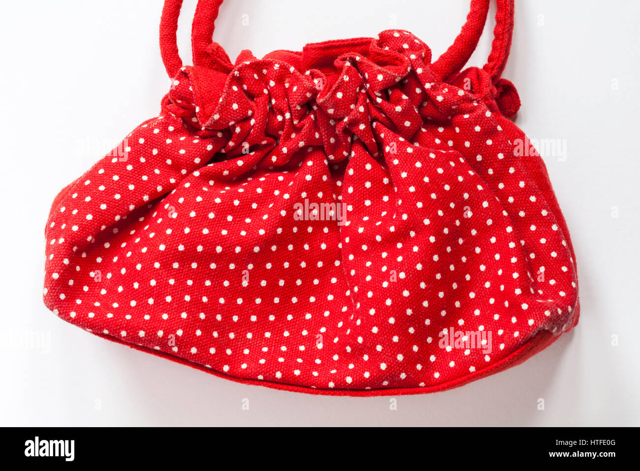 Red and white polka dots bag set on white background Stock Photo - Alamy
