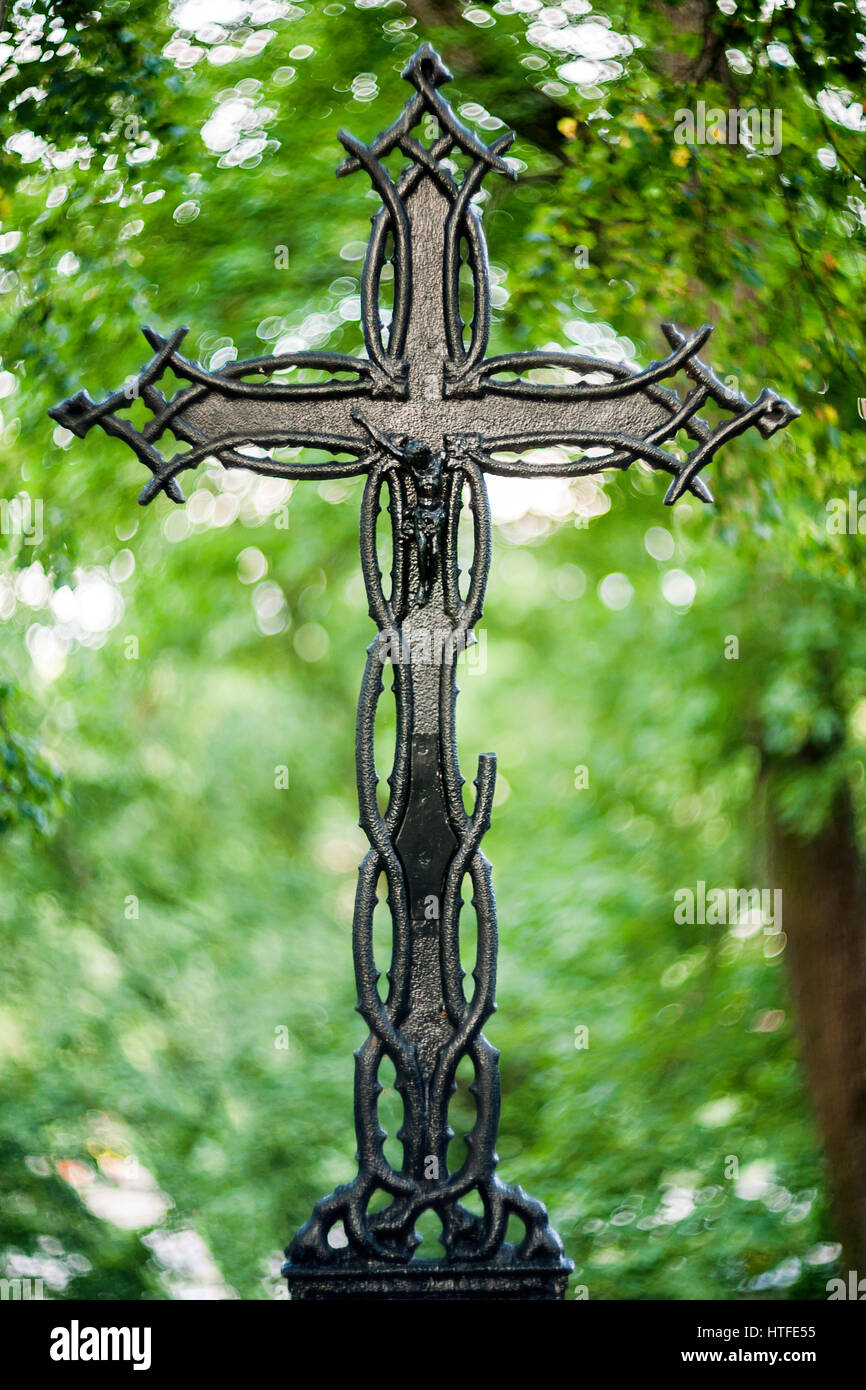 Old rusty metal cross in a cemetery, shot with a low dof Stock Photo ...