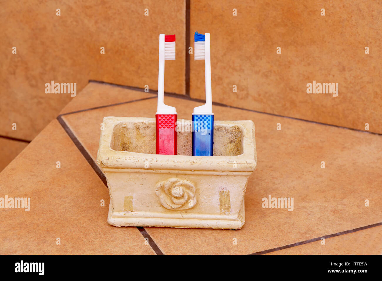 Red and blue toothbrushes Stock Photo - Alamy