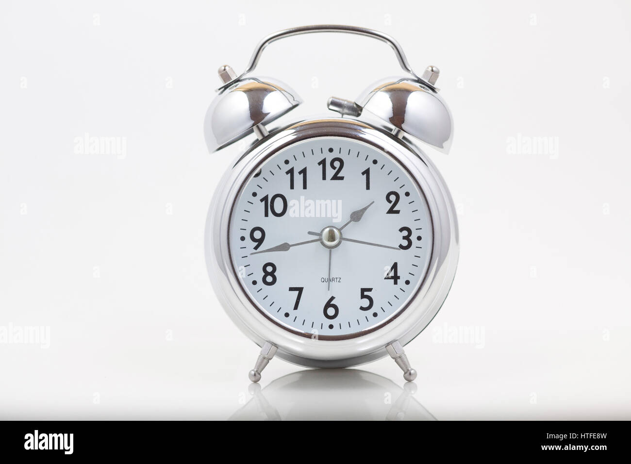 Clock on white background Stock Photo - Alamy