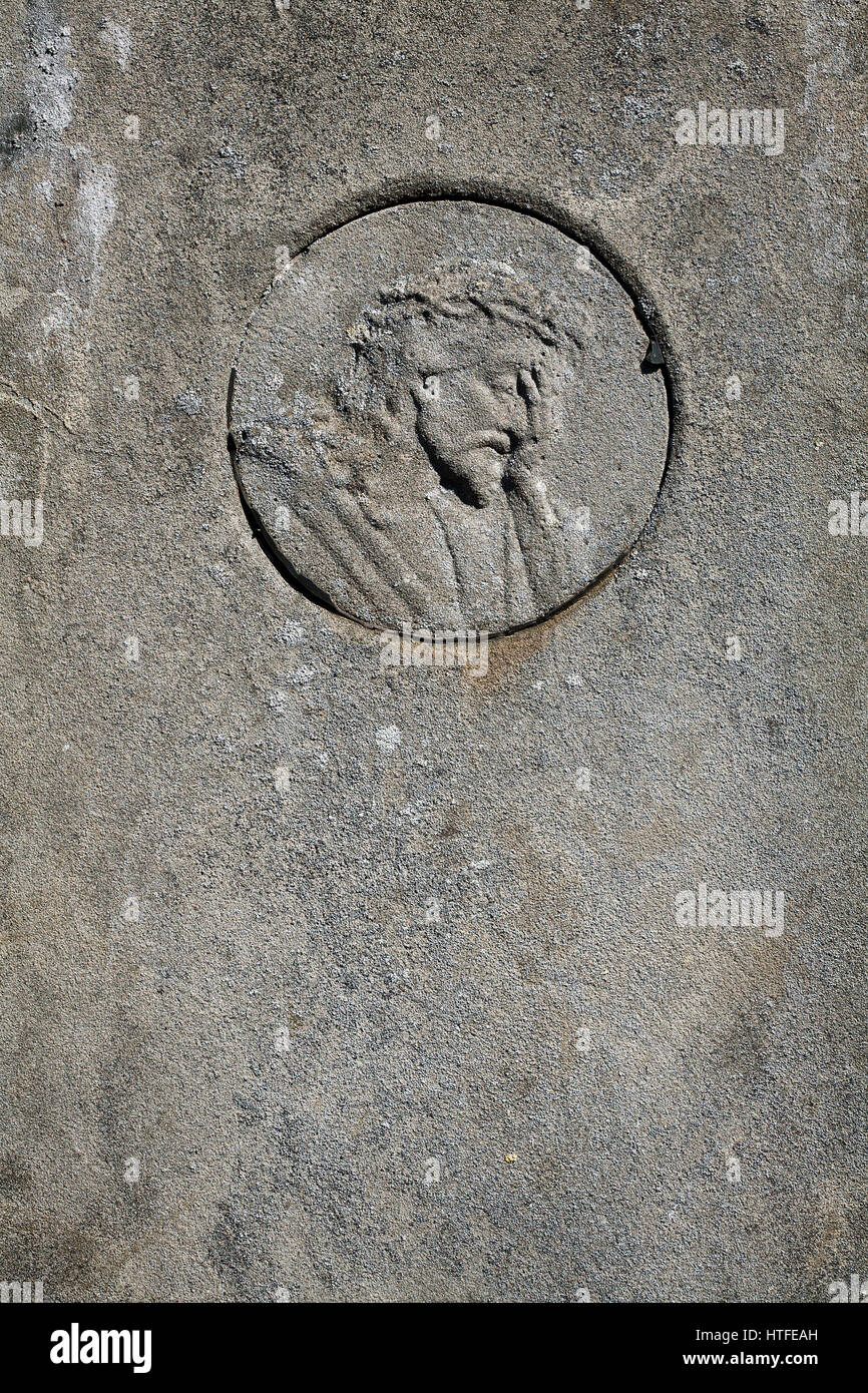 Face of Jesus Christ on cement tomb stone with copy space Stock Photo ...