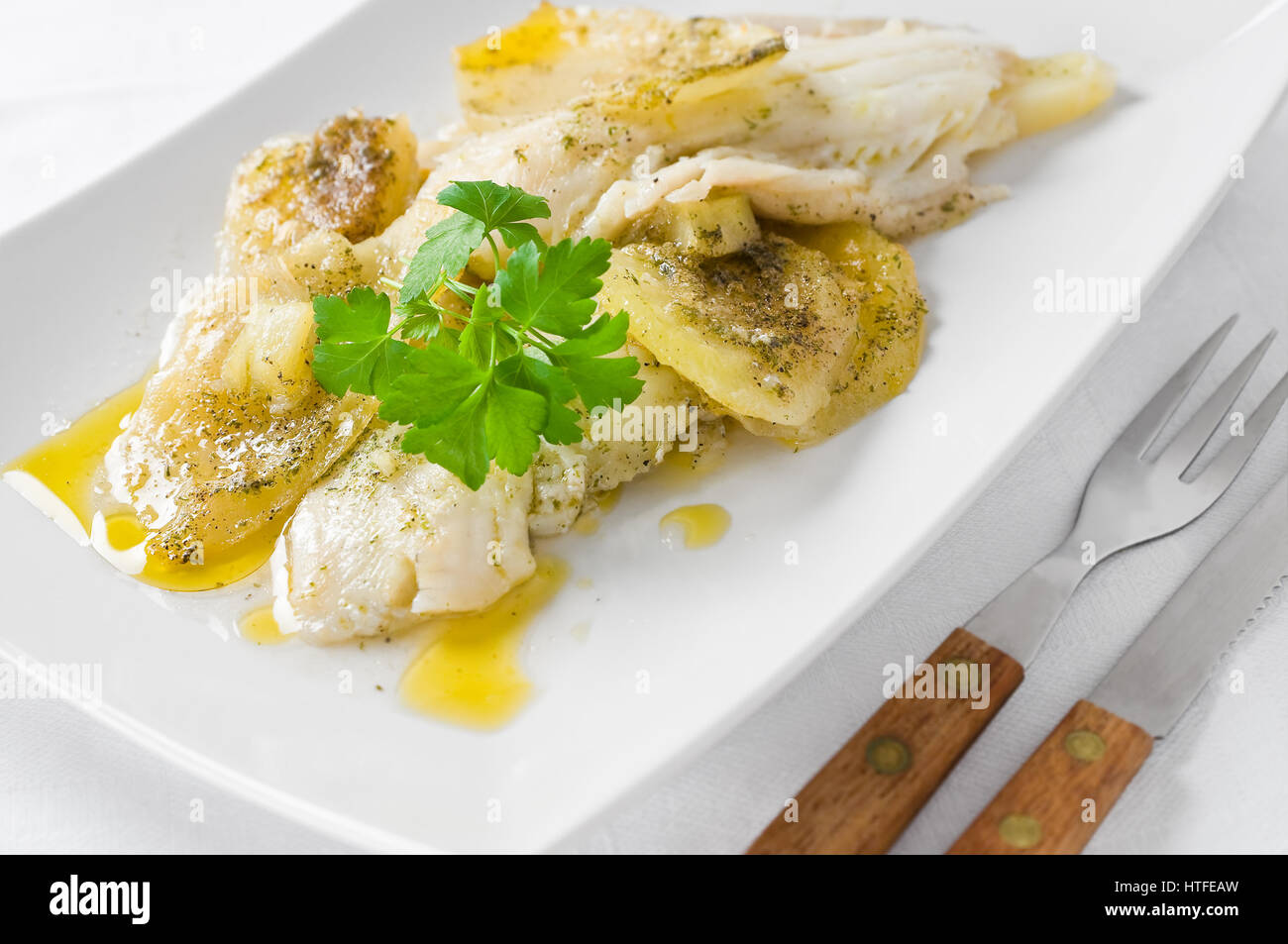 Fish with potatoes Stock Photo - Alamy