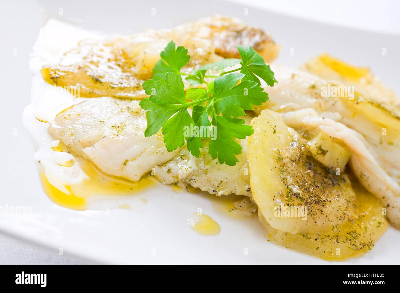 Fish with potatoes Stock Photo - Alamy
