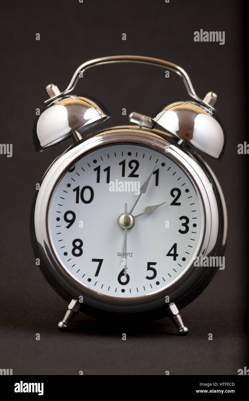 Clock on white background Stock Photo - Alamy