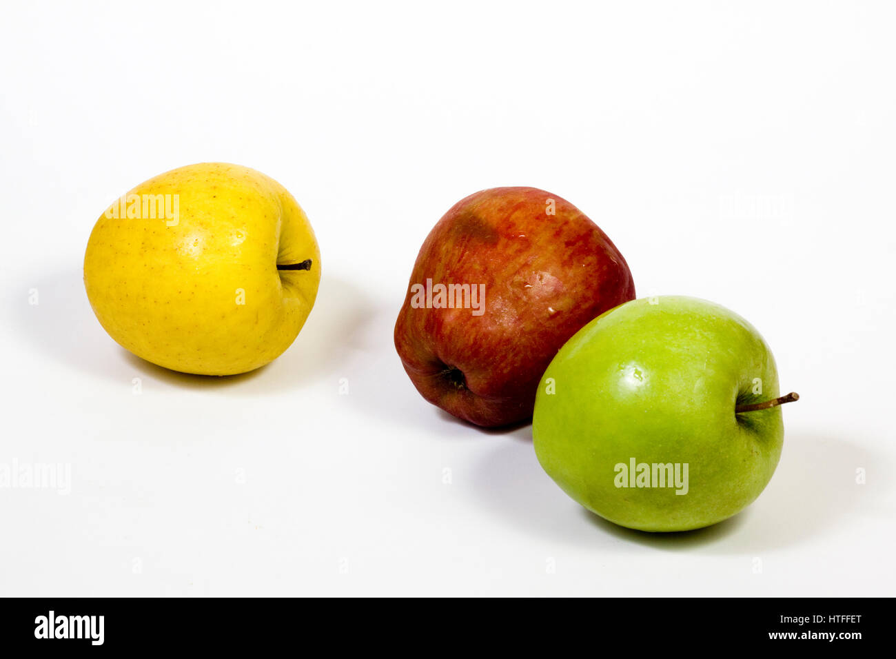 apples colored on white background Stock Photo - Alamy