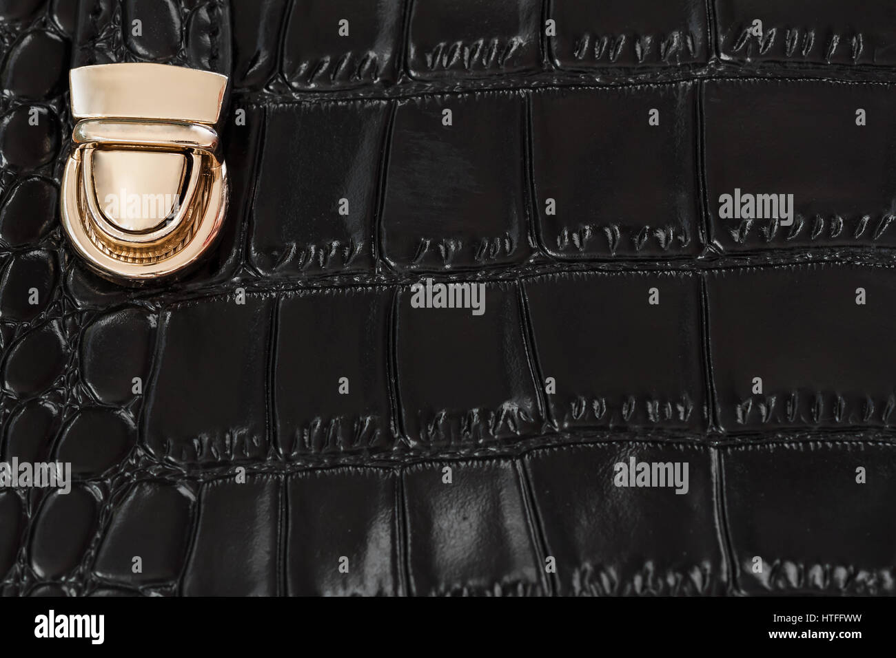 Close-up texture of black handbag from genuine leather with embossed ...