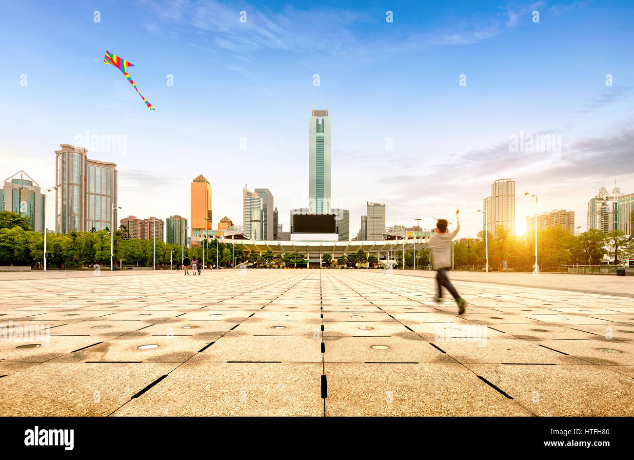 Guangzhou, China, the city square kite flying boy Stock Photo - Alamy