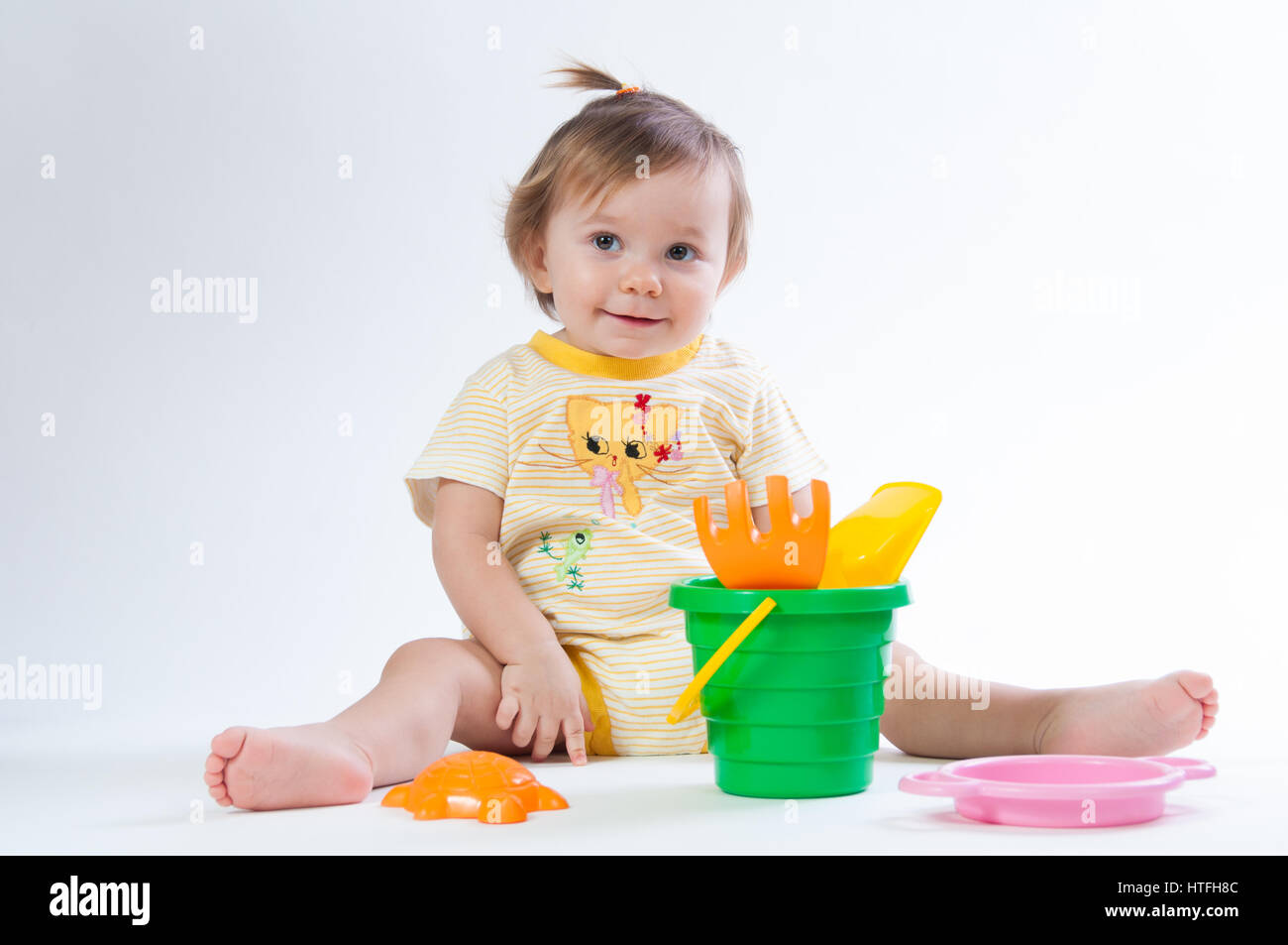 Cute baby with bucket and spade isolated on white background Stock ...