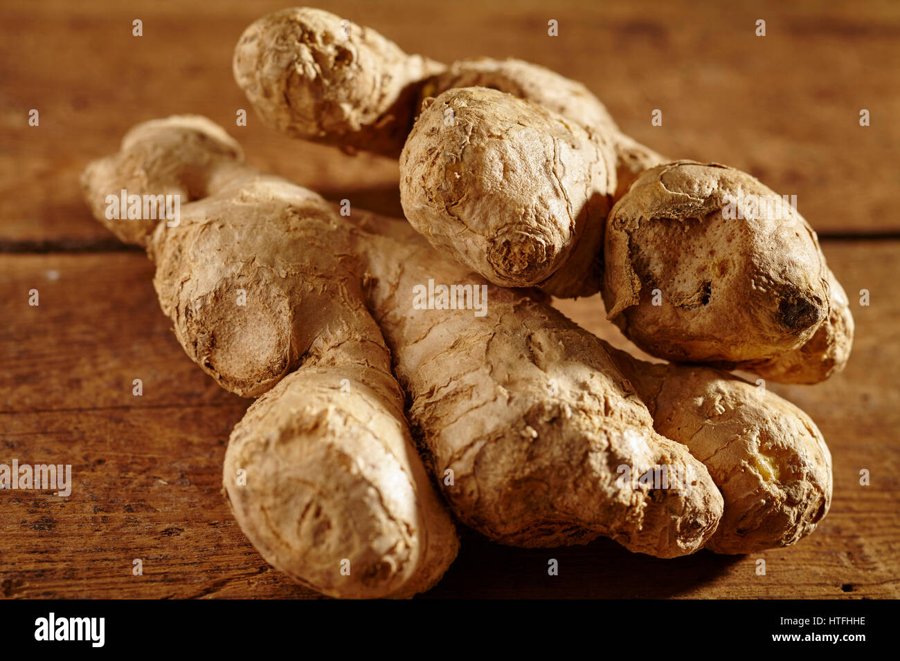 Fresh, whole ginger root, a key ingredient in many cuisines Stock Photo ...