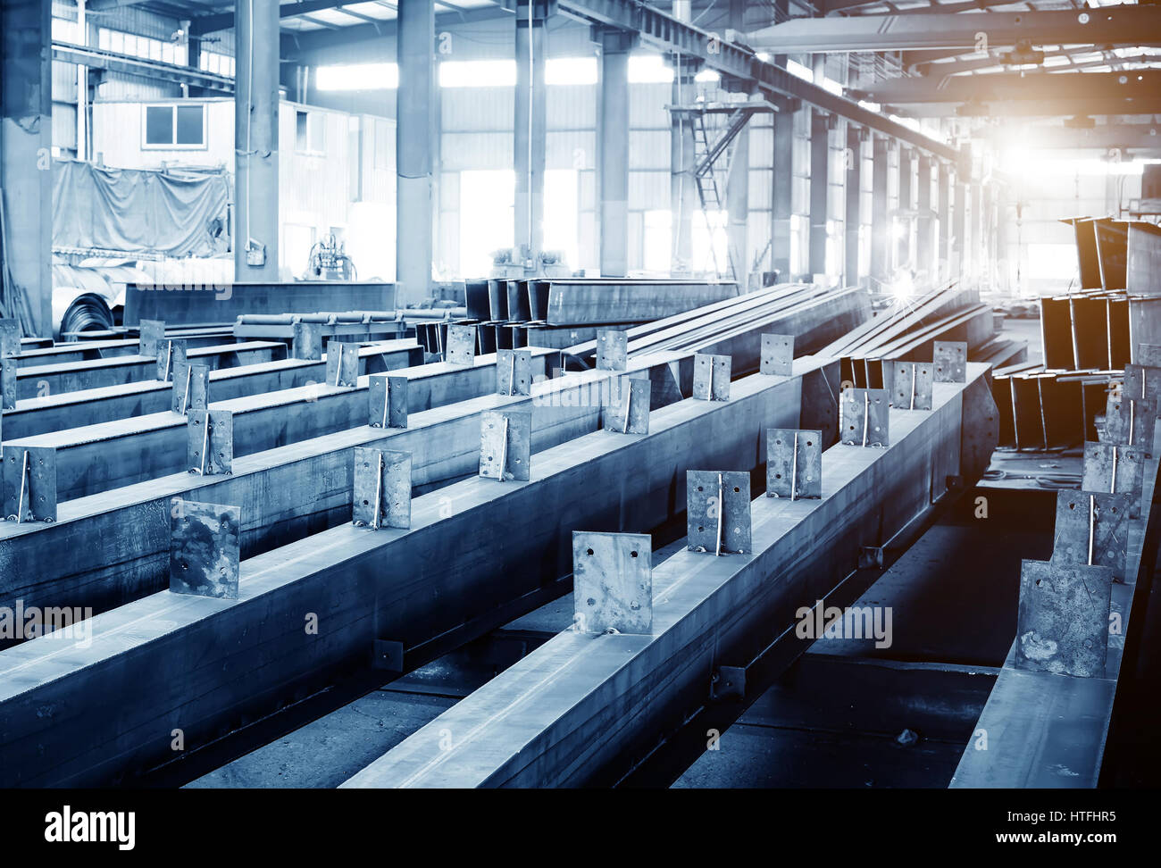 Steel factory floor, stacked with a lot of steel Stock Photo - Alamy