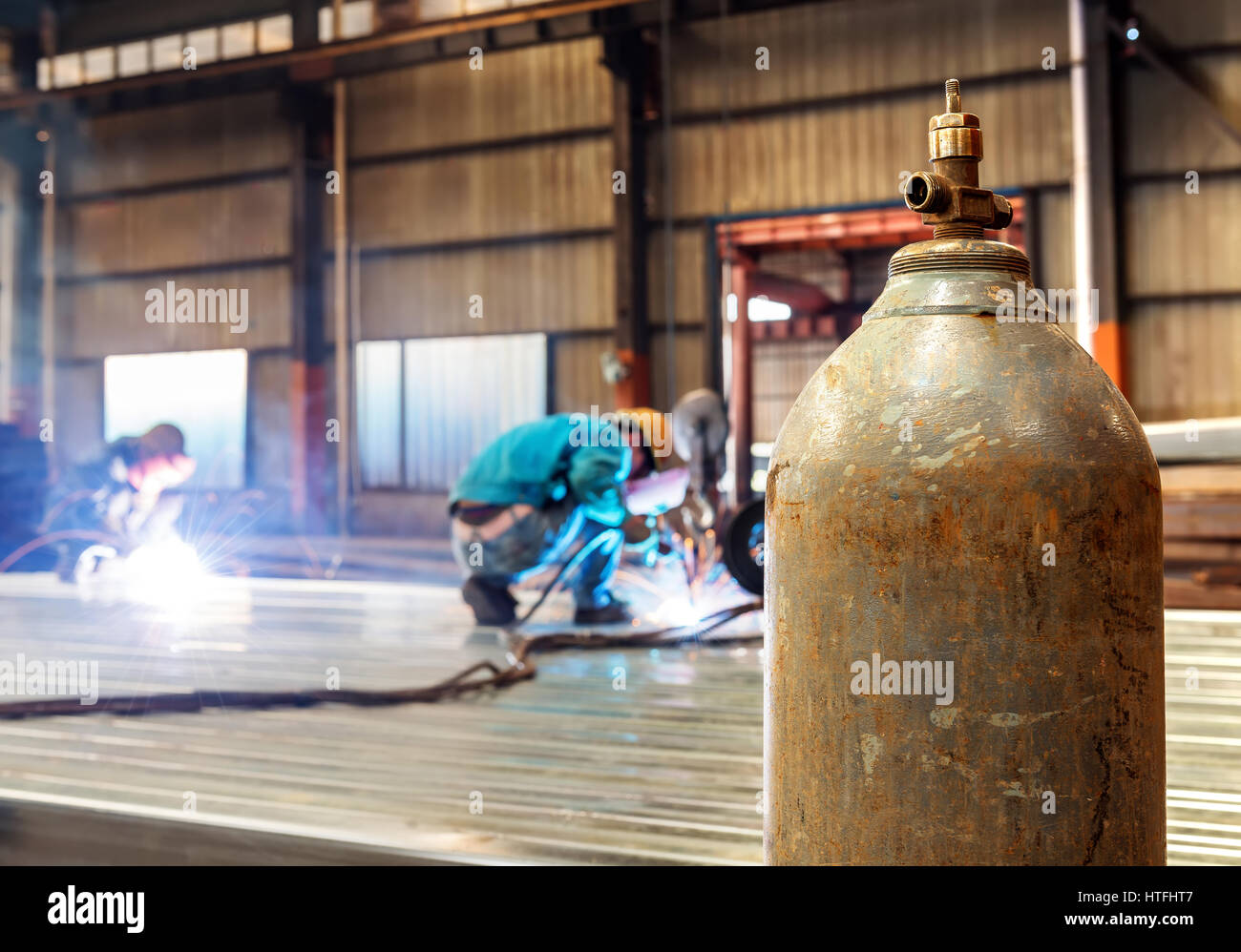 Workers at work, ongoing welding operation Stock Photo - Alamy