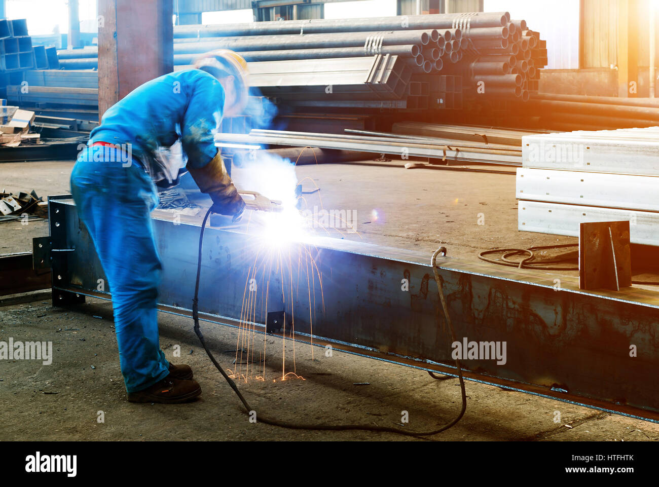 Workers at work, ongoing welding operation Stock Photo - Alamy