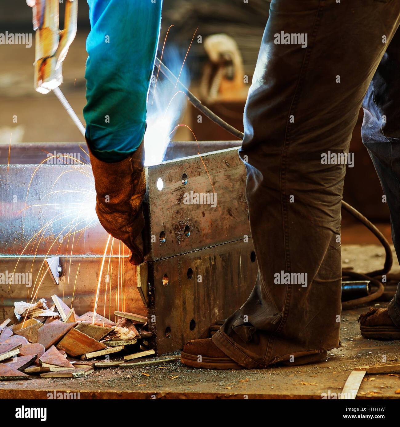 Workers at work, ongoing welding operation Stock Photo - Alamy