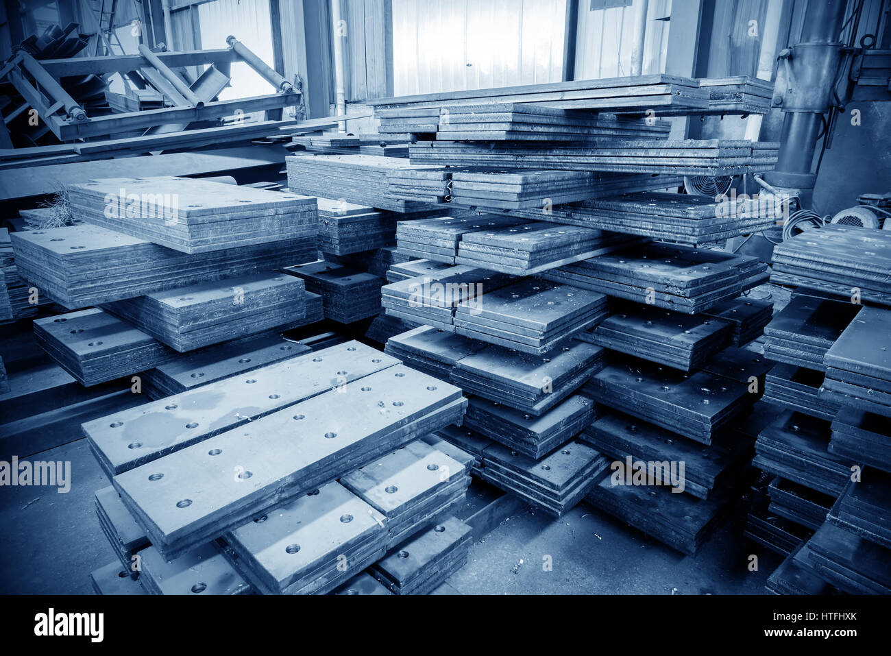 Steel semi-finished steel factory, blue tone image Stock Photo - Alamy