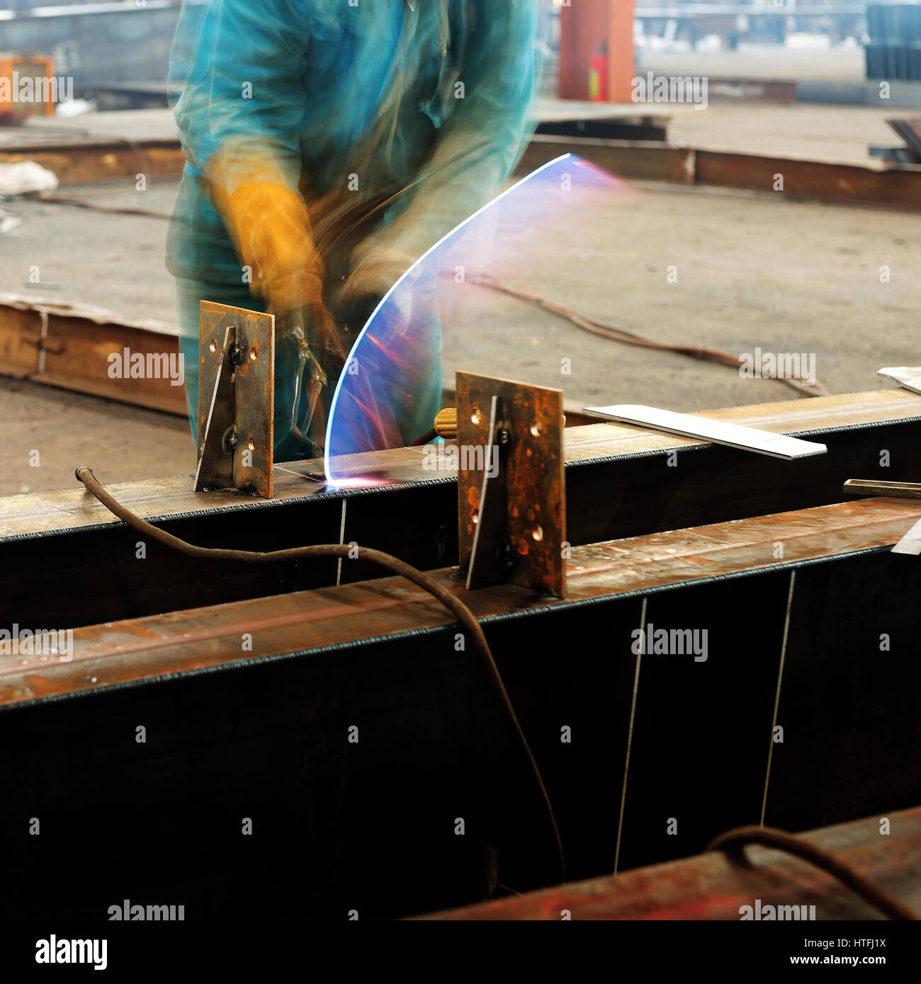 Workers at work, ongoing welding operation Stock Photo - Alamy
