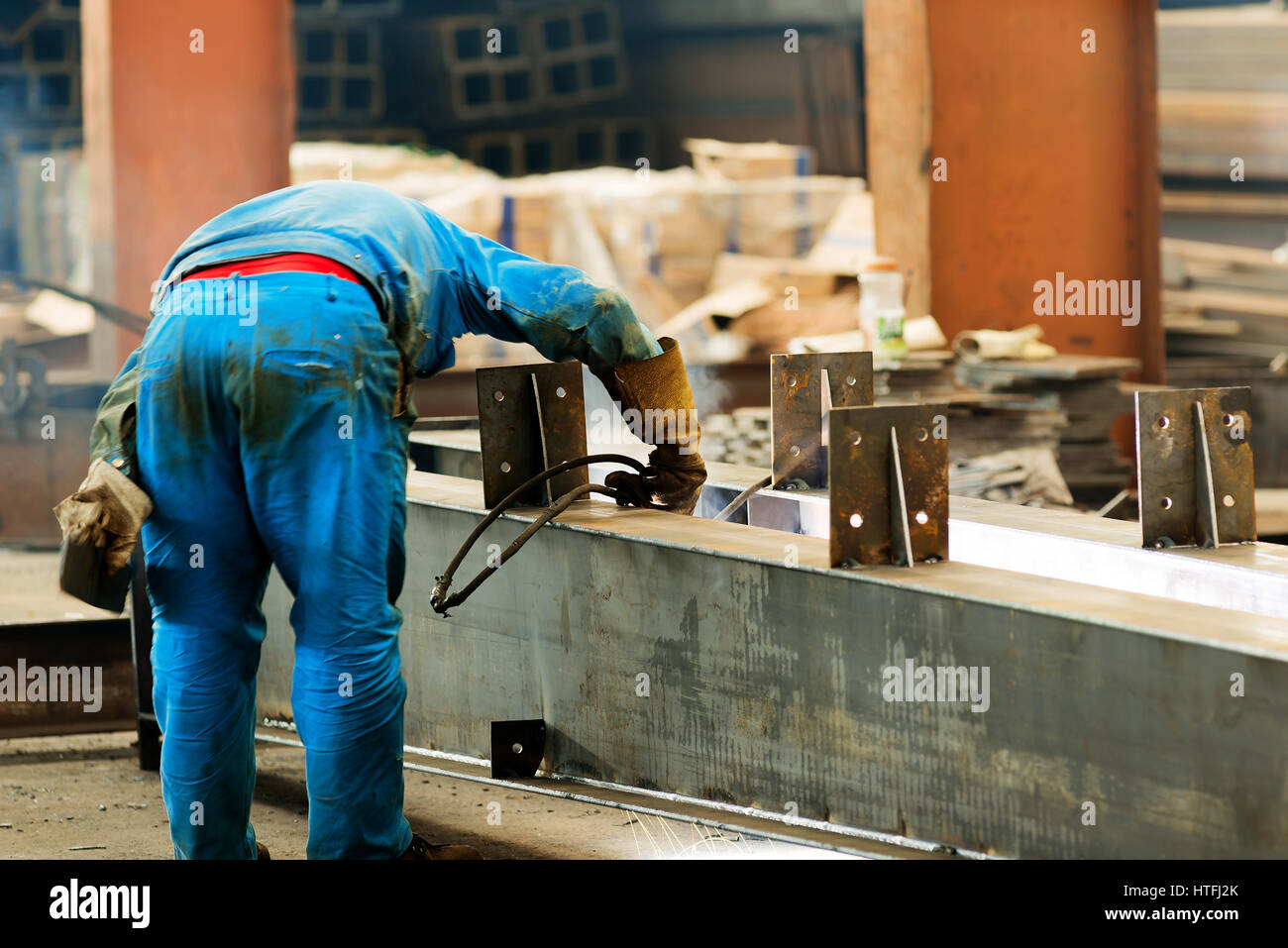Workers at work, ongoing welding operation Stock Photo - Alamy
