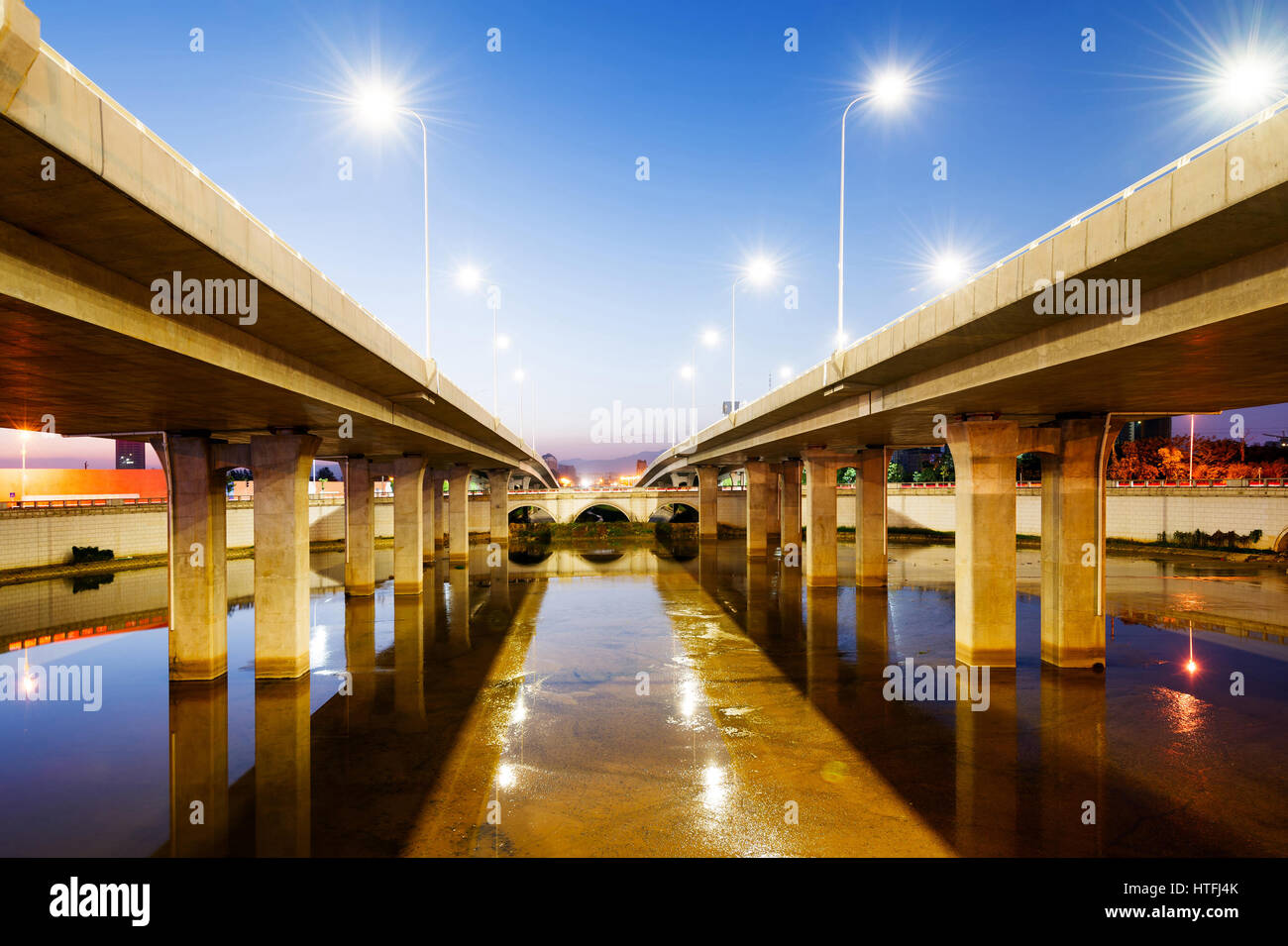 Bridge approach spans part of modern, urban landscape Stock Photo - Alamy